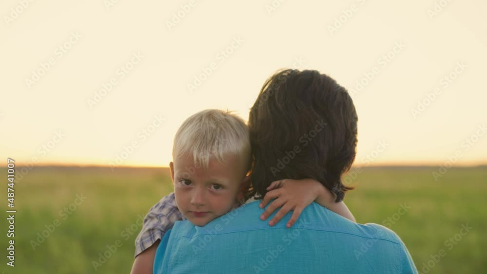 Happy cute affectionate mother hugs her beloved kid, son on walk in ...