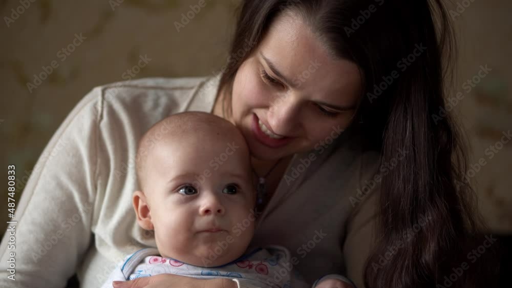 Newborn Active Baby With Young Mom. Cute Smiling Teethless Face ...