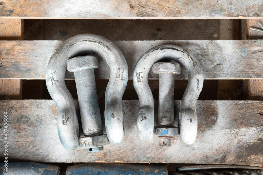 Iron shackles lifting equipment which is spray by white color to ...