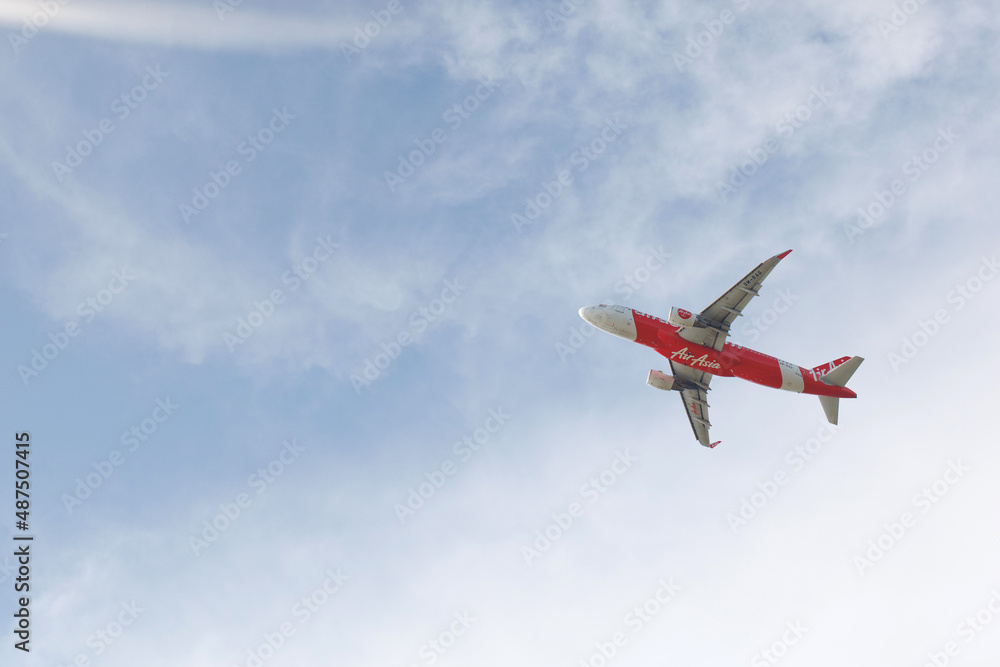 PENANG, MALAYSIA - 29 JAN 2022: AirAsia plane flying directly overhead ...