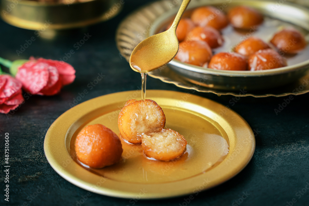 Gulab jamun gulaab jamun sugar syrup golden bowl Indian sweet food ...