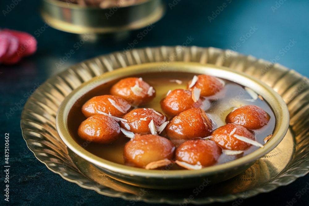 Gulab jamun gulaab jamun sugar syrup golden bowl Indian sweet food ...