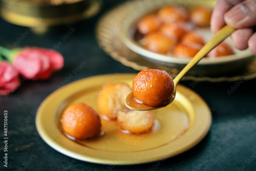 Gulab jamun gulaab jamun sugar syrup golden bowl Indian sweet food ...
