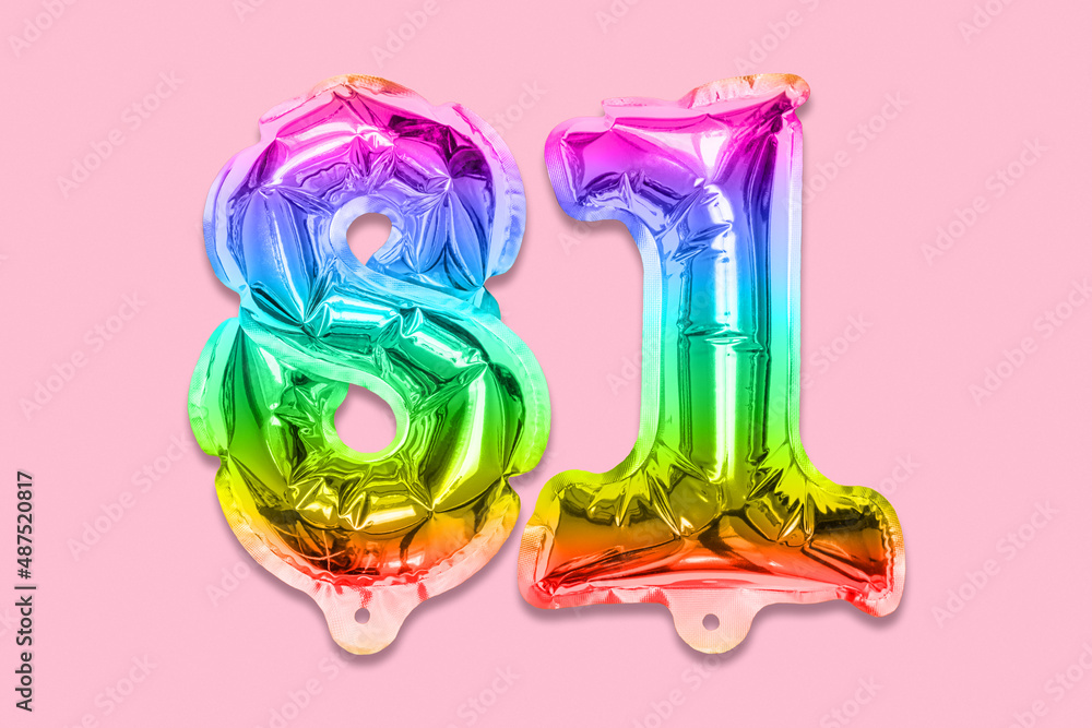 Rainbow foil balloon number, digit eighty one on a pink background ...