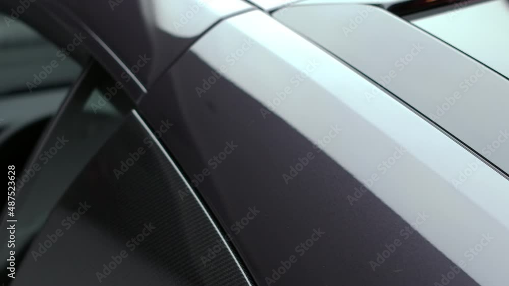 Side Blades And Side Body Of Sleek-looking Sports Car In The Garage ...
