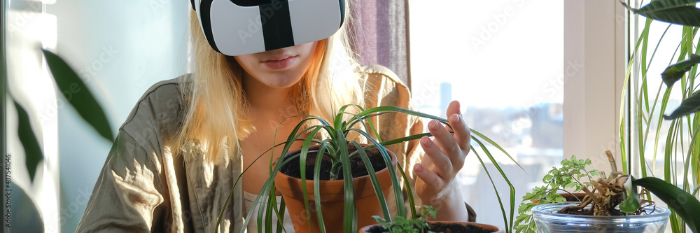 Gardening.Virtual world, metaverse.Girl planting flowers in immersive ...