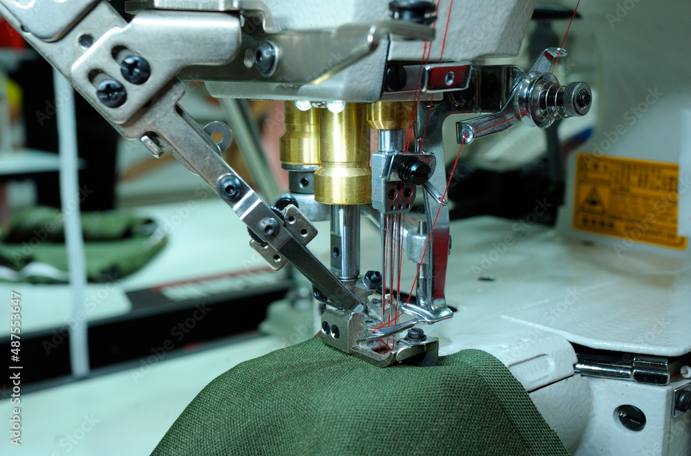 Pro electric sewing machine working. Piece of cloth, needle bar ...