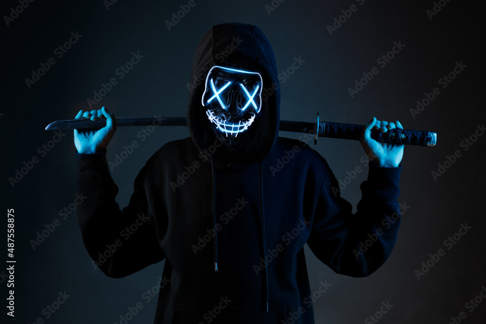 Anonymous with a sword in hand. Dangerous hacker. Internet, cyber crime ...