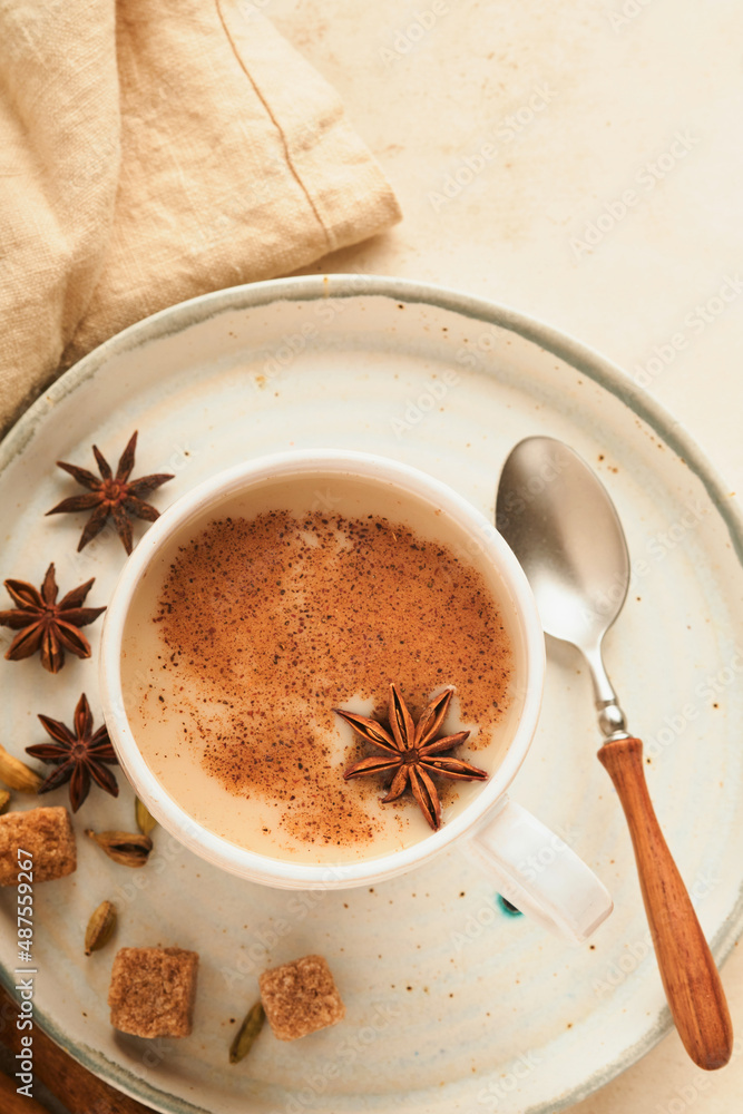 Masala tea. Masala chai spiced tea with milk and spices on light warm ...