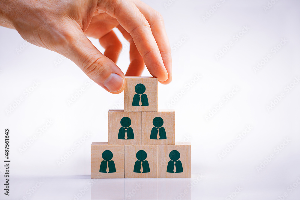 The Hand Forms a Pyramid of Wooden Cubes with the Manager Icons. Team ...