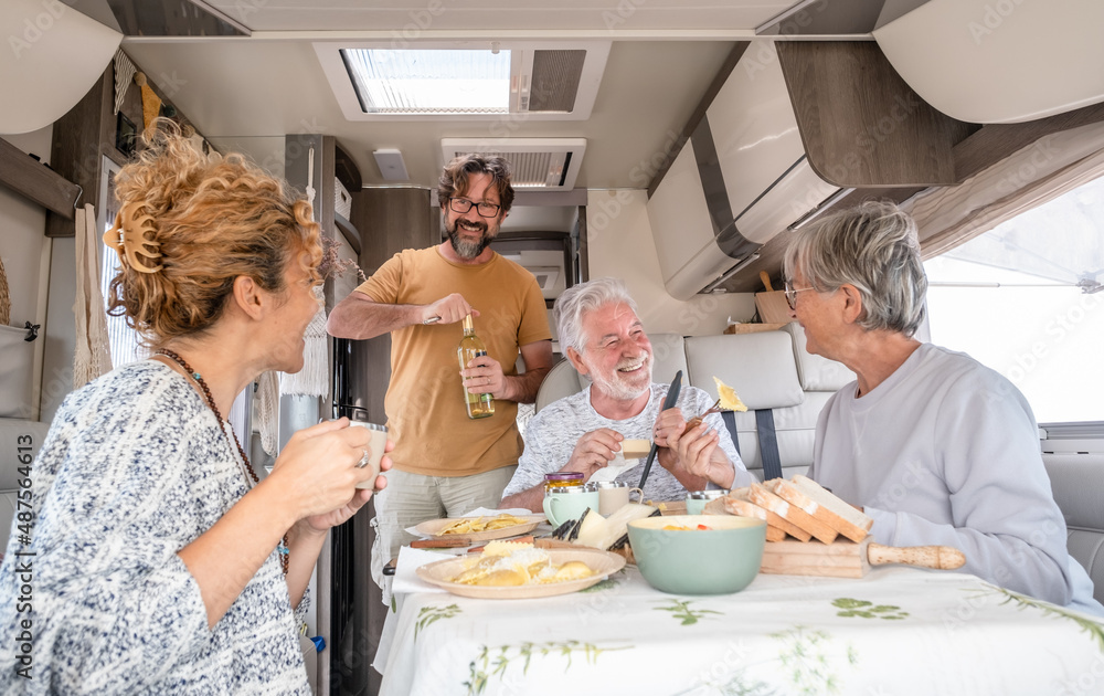 Happy group of caucasian multigenerational family sitting inside a ...