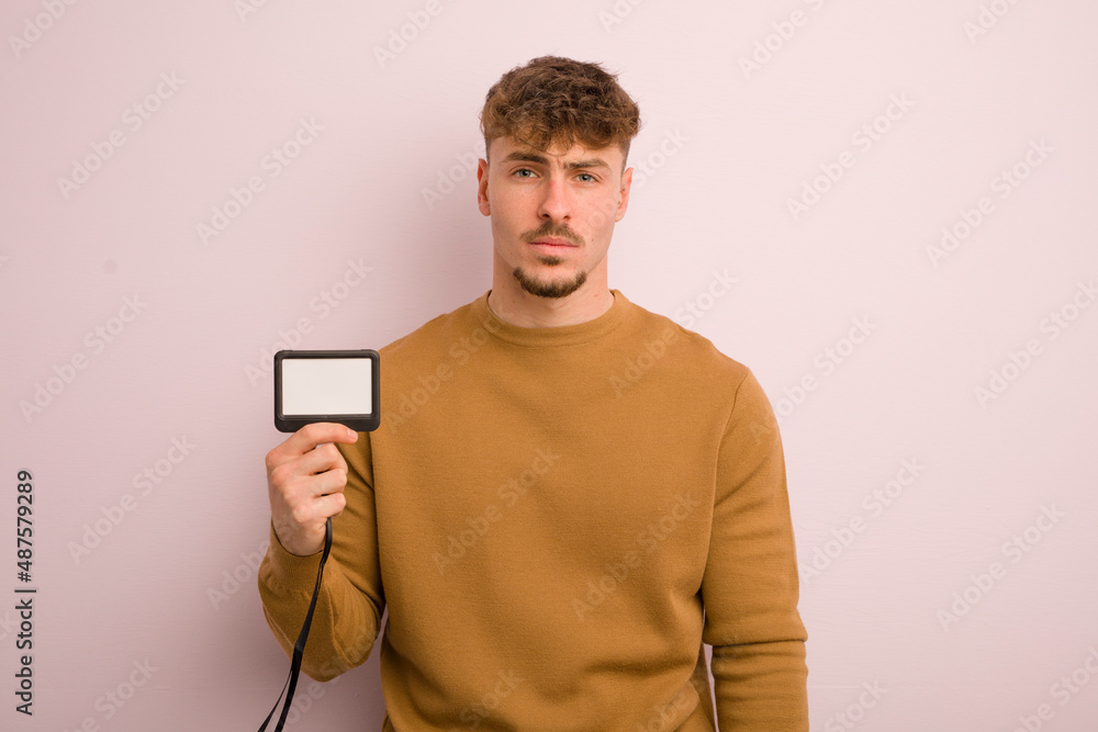 young cool man feeling sad and whiney with an unhappy look and crying ...