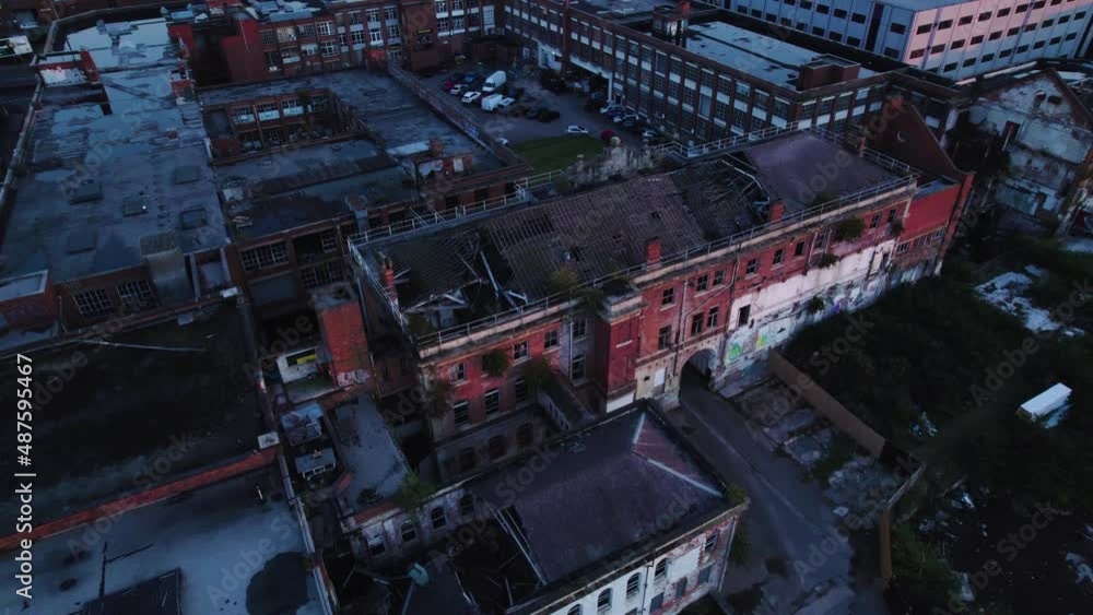 Broken old roof of rundown building filmed slowly moving forward and ...