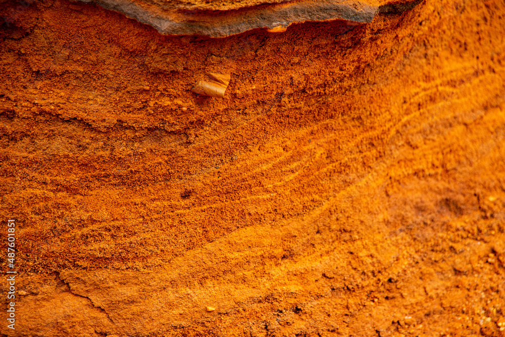 Textural sand, with relief surface, multi-colored layers and different ...