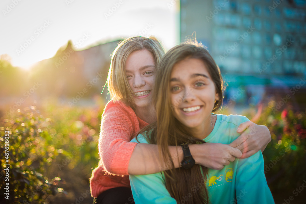 Two smiling girls. Two friends. Happy female students having fun ...