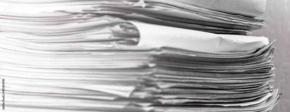 bundles bales of paper documents. stacks packs pile on the desk in the ...