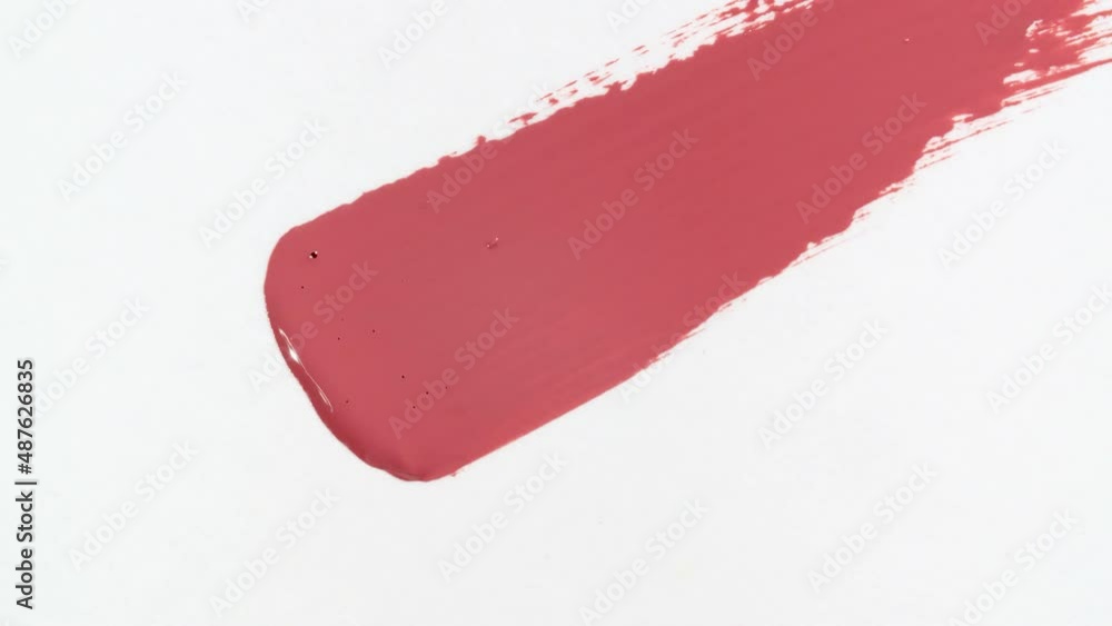 Cosmetic liquid lip gloss, lipstick smudge, smear, stroke. Brush ...