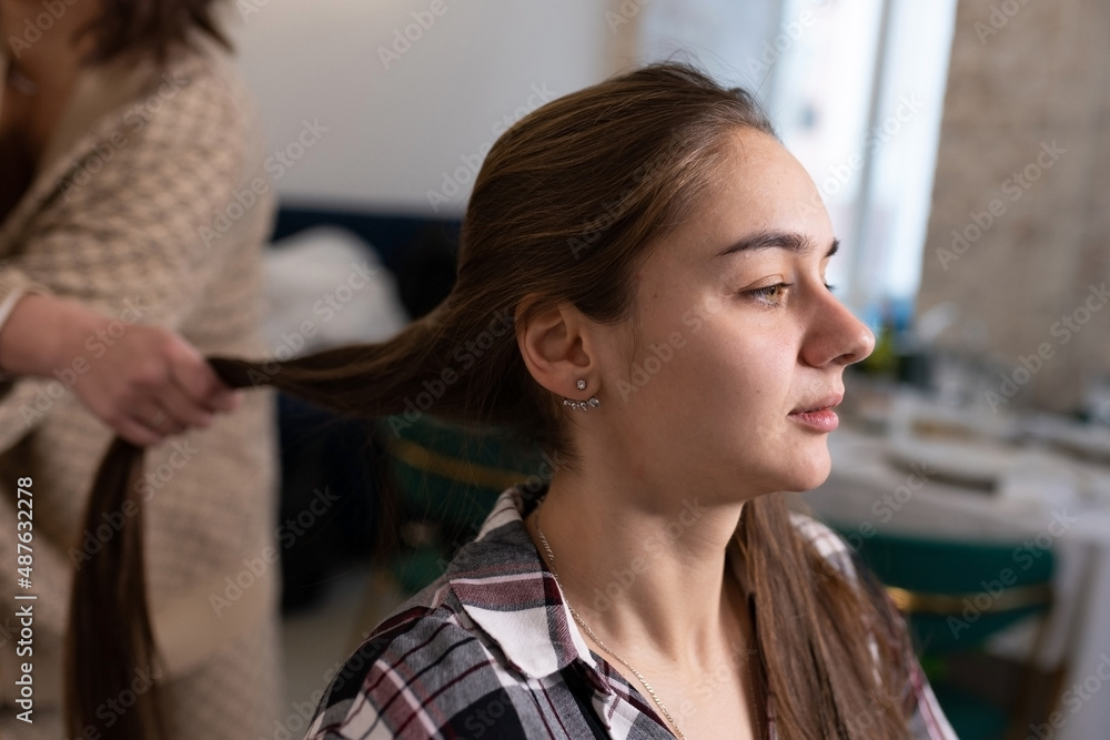 Shaping hairstyles by a hairdresser using a styler. Stock Photo | Adobe ...