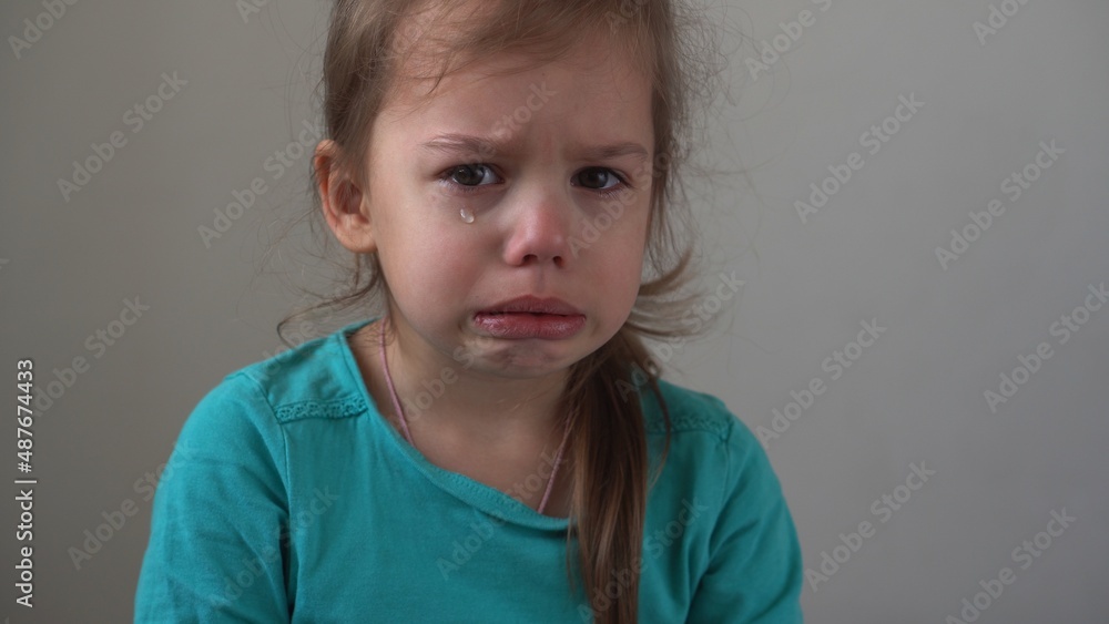 Portrait little girl sad upset child burst into tears cries sob looking ...