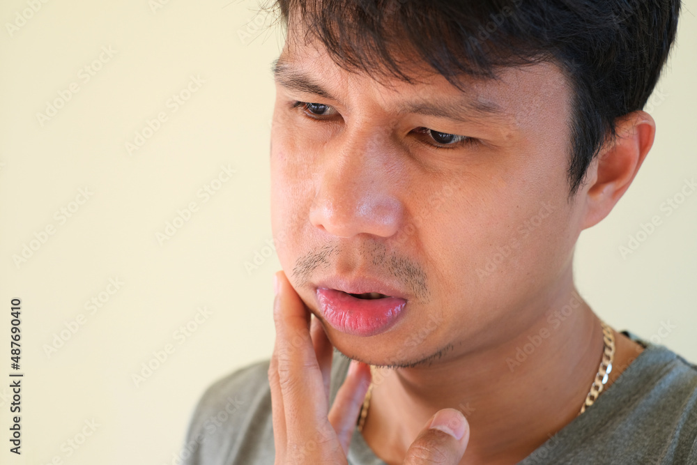 Teetch problem. Asian male with painful cheek swelling or dental ...