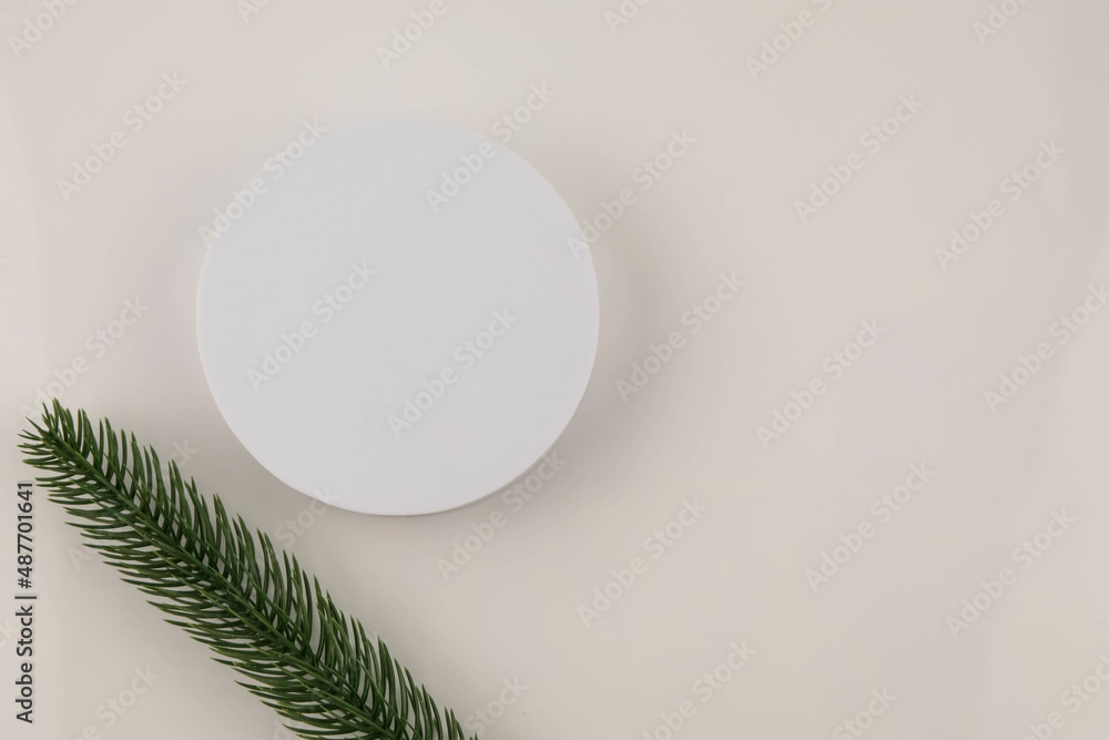 White background with white pallet props and green pine leaves ...