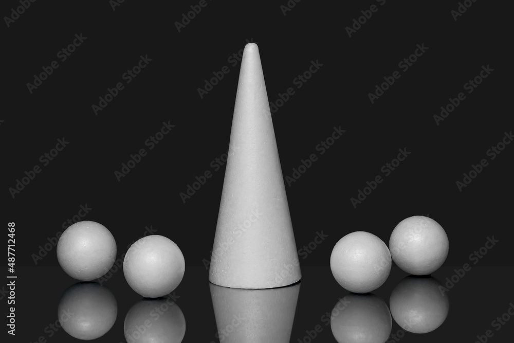 3d geometric shapes on black isolated background with reflection. White three-dimensional cone ...