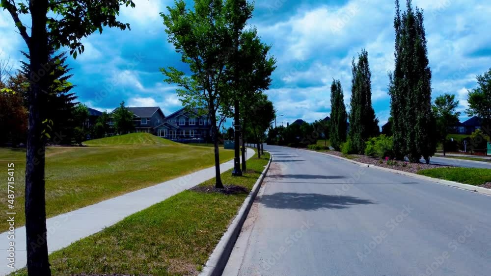 Summer blue white clouds forming at mysterious driveway leading to some ...