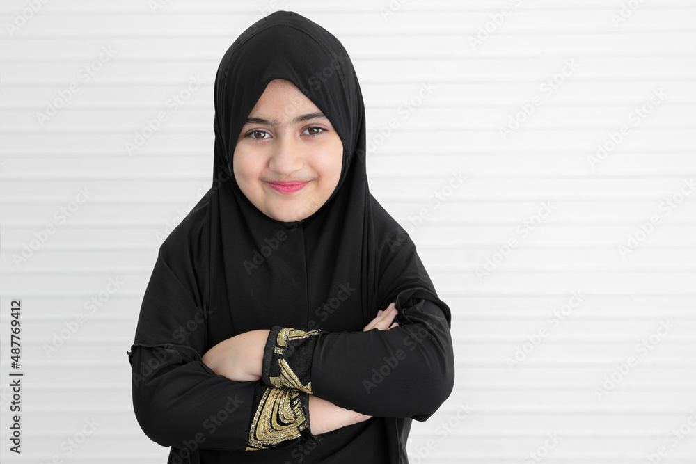 Little Asian Pakistani Muslim girl wearing black hijab with beautiful ...