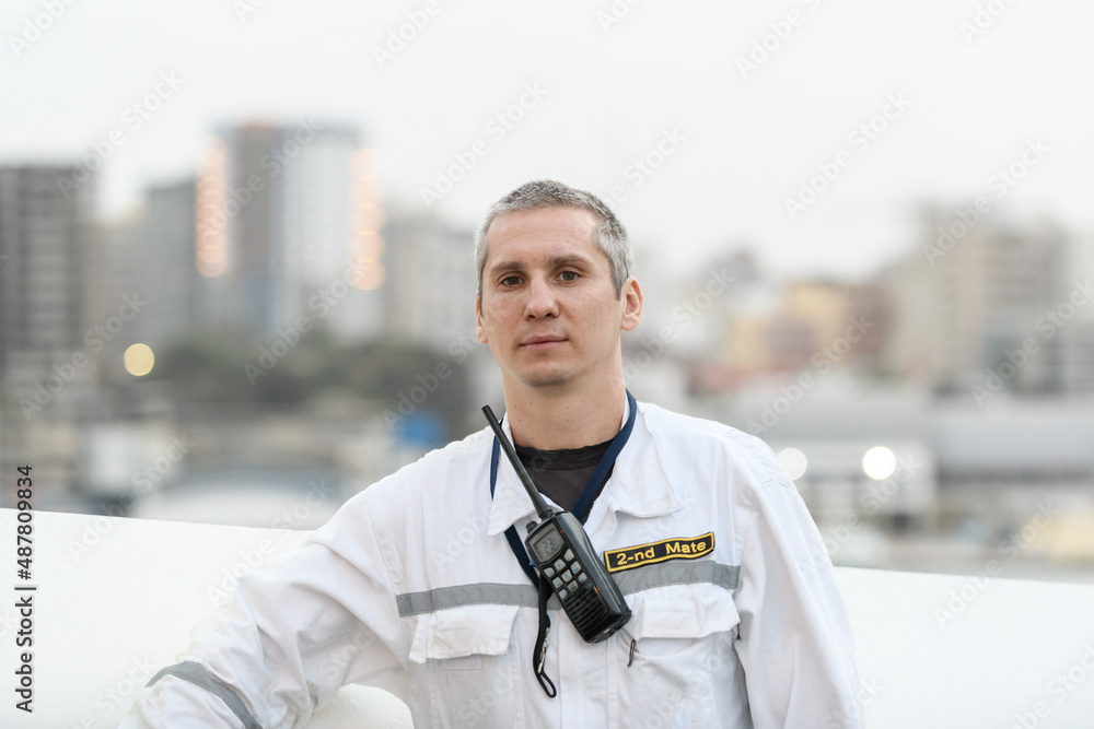 Foto de Deck officer on watch during cargo operations. Man in white ...