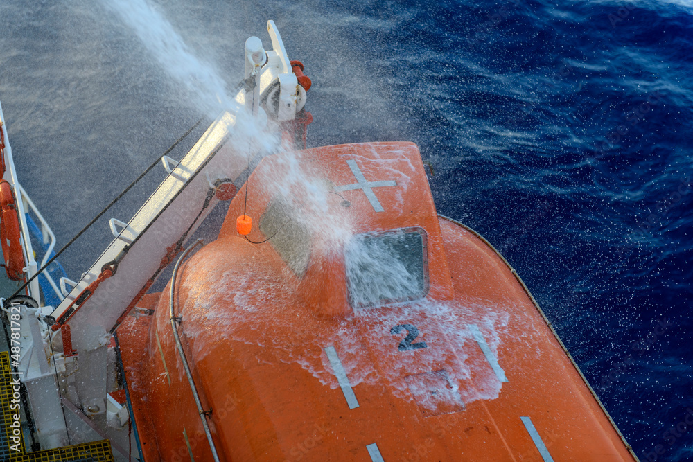 Hose pressure water test of totally enclosed lifeboat. Watertight test ...