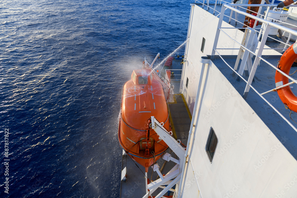 Hose pressure water test of totally enclosed lifeboat. Watertight test ...