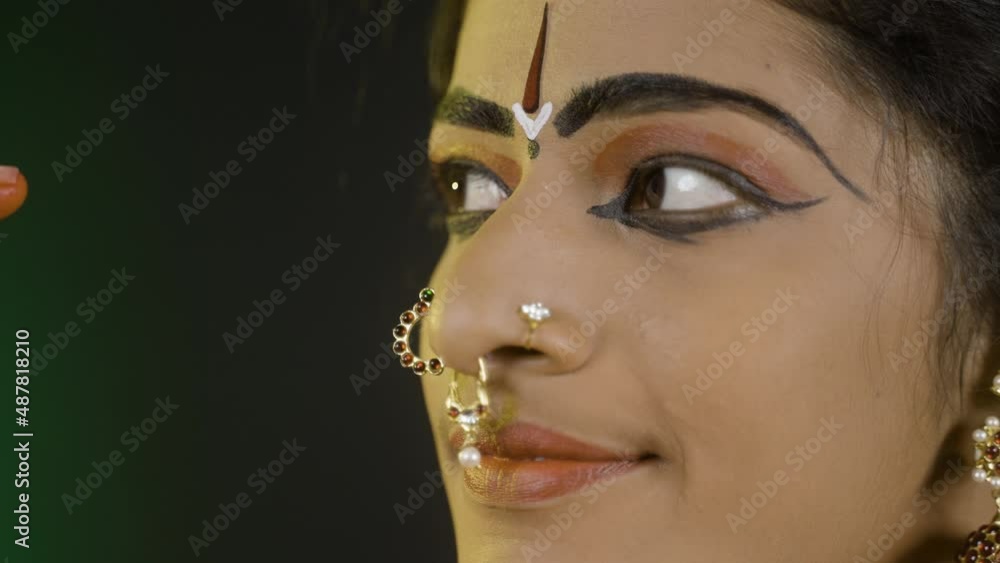 Close up shot of bharatanatyam dancer doing eye moments or drishti ...