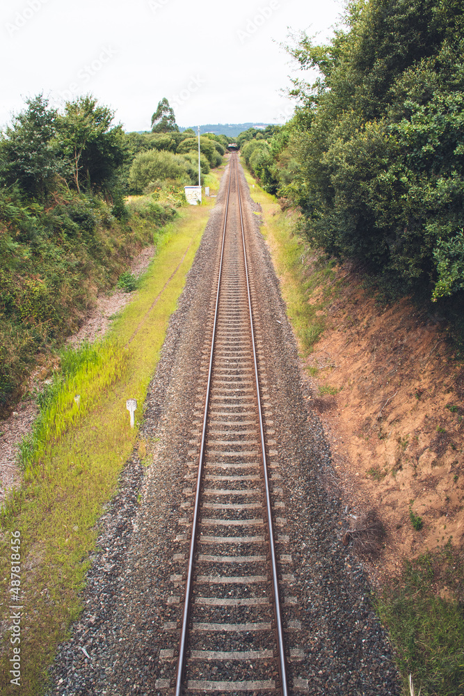 railway in a straight line in the middle of nature, means of transport ...