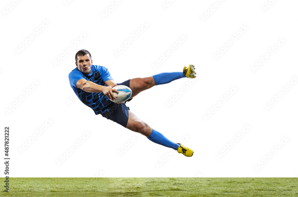 One man, rugby player catching ball in jump isolated on white ...