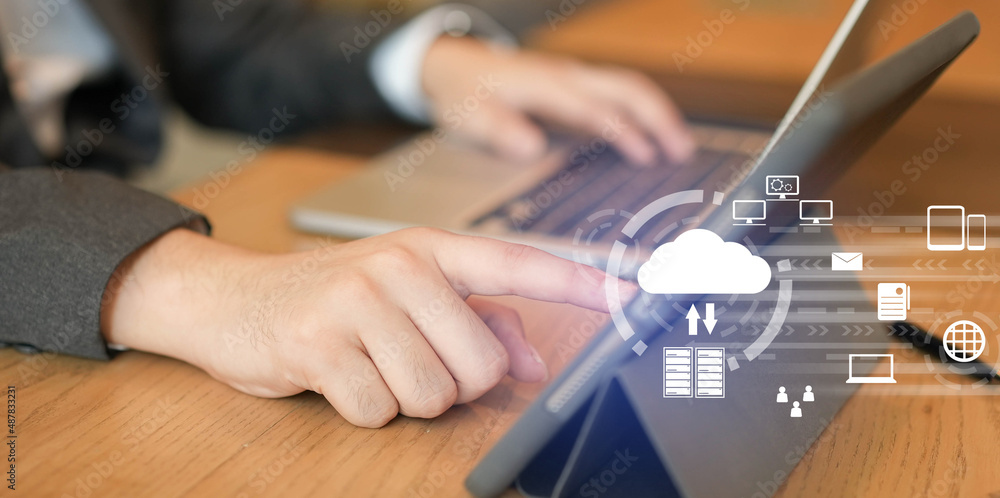 Foto de close up man hand typing on keyboard for transfer or synch data upload and download from ...