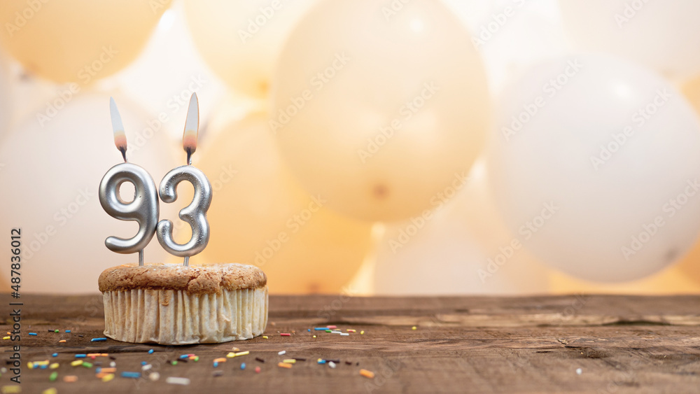 Happy birthday card with candle number 93 in a cupcake against the ...