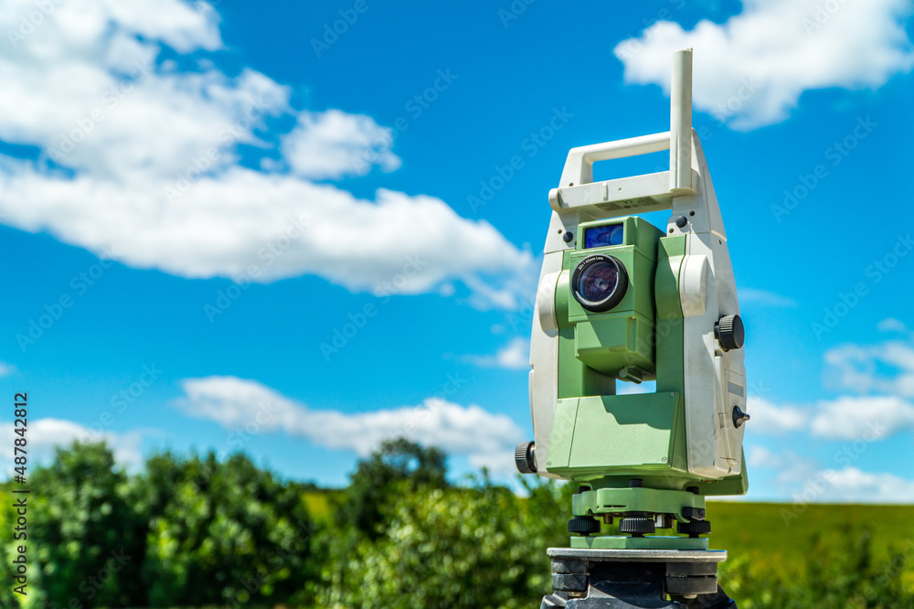 Surveyors equipment (theodolite or total positioning station) on the ...