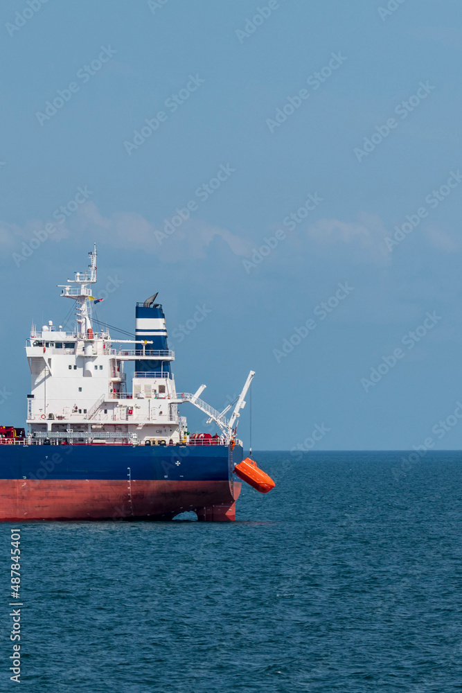 Lowering and Maneuvering orange free fall lifeboat in water. Abandon ...