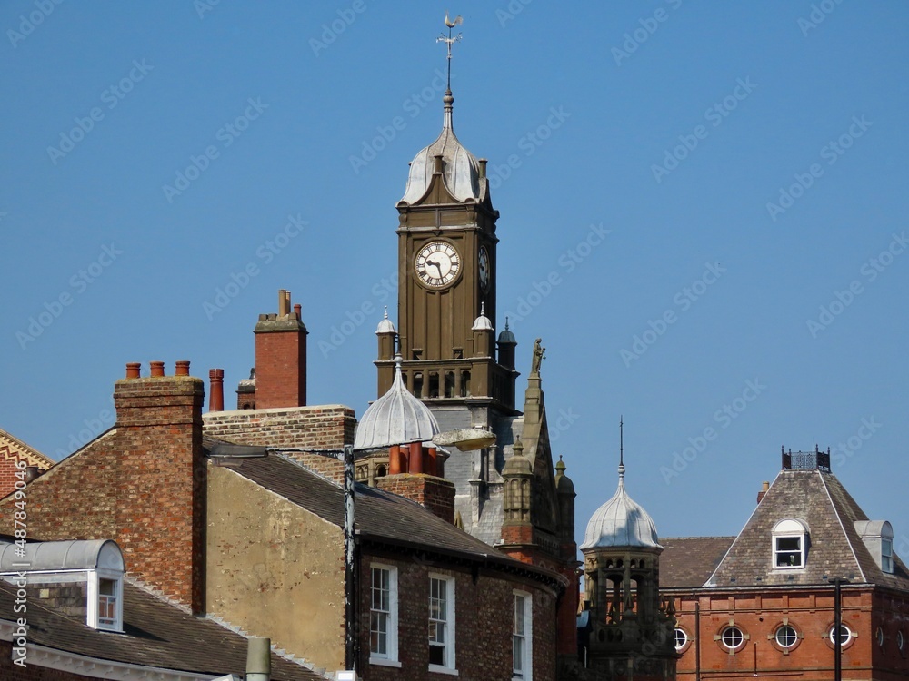 York Magistrates court building clock tower over roofs of traditional ...