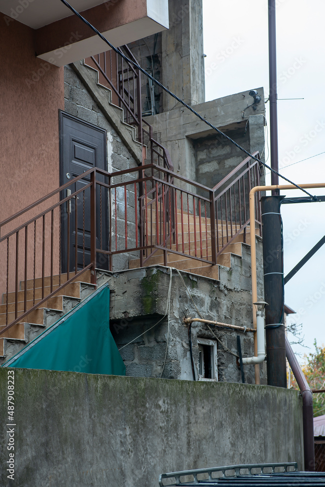 Stairs with railings leading to the 2nd floor of a residential building ...