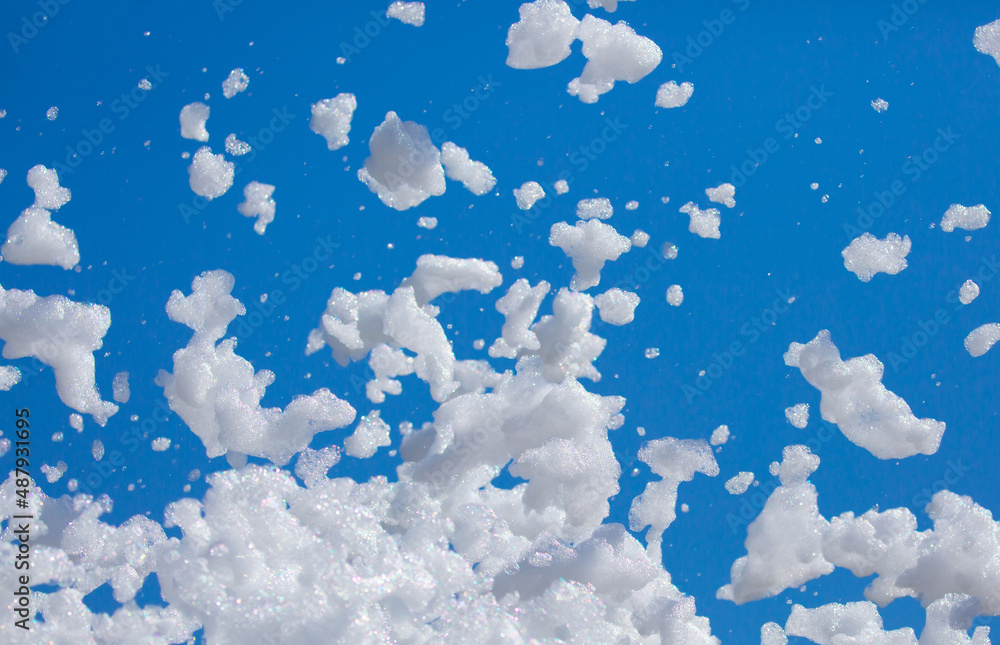 White soap foam on a blue background. Fun foam, background or texture ...