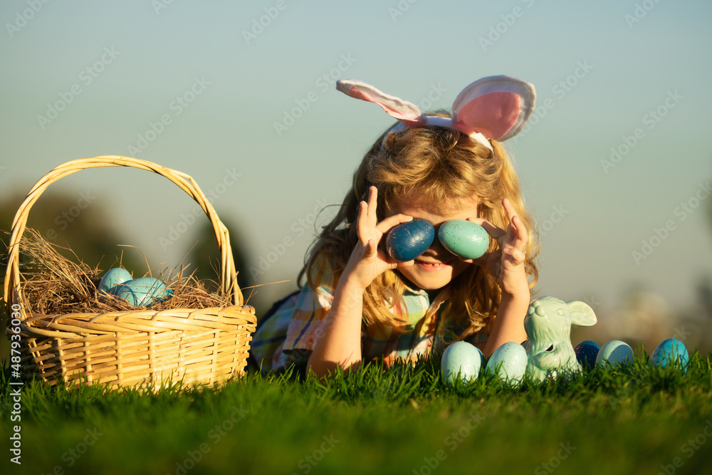 Easter egg hunt in garden. Children playing in field, hunting easter ...