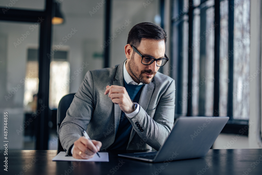 Hardworking man with glasses, making his schedule for work. Stock Photo ...