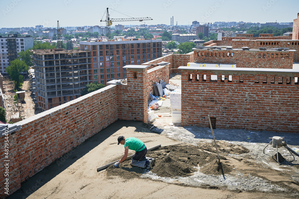 Construction site with newly built apartment buildings, tower crane and ...