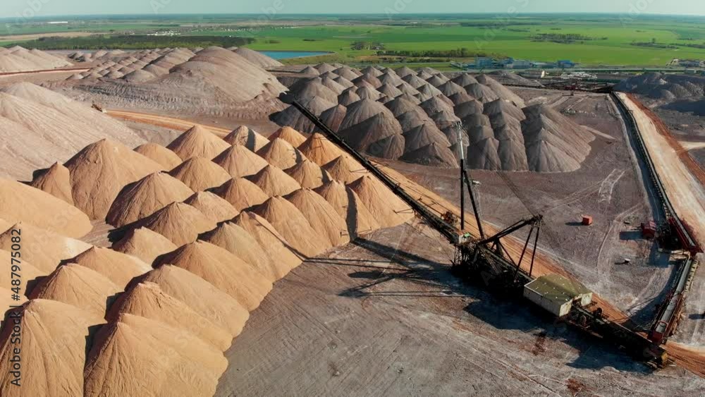 Mining industry close up. Telestacker handles the ore for potash waste ...