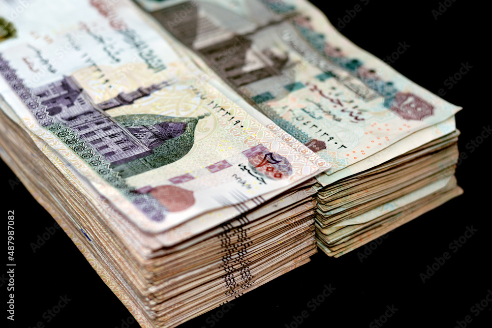 Stacks of obverse sides of 200 LE and 100 LE Egyptian pounds banknotes ...