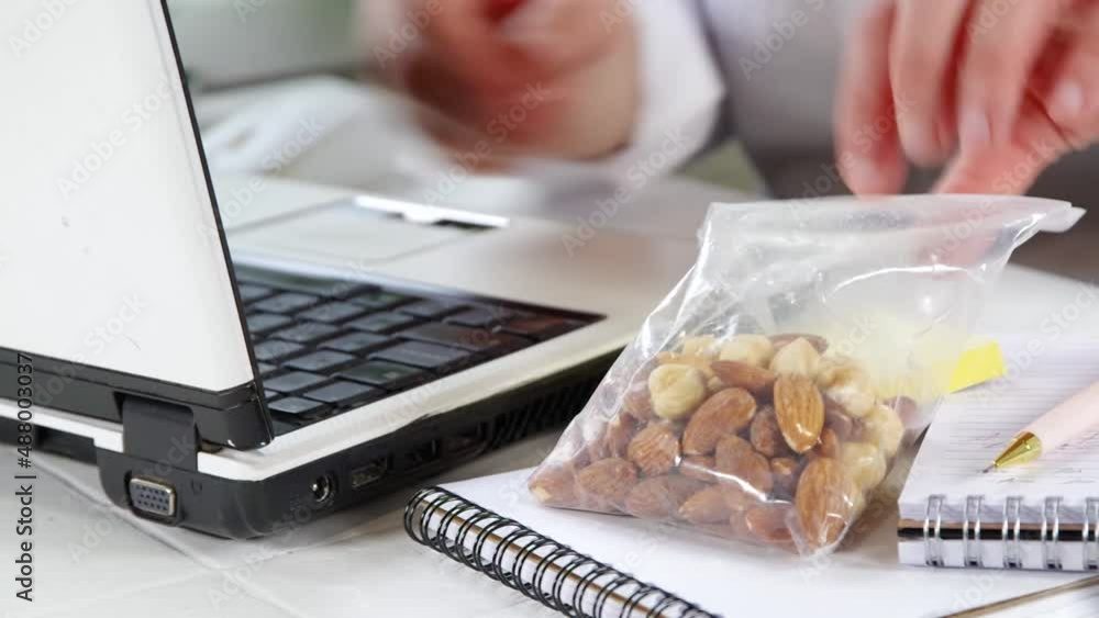 Healthy snack video. Diet and healthy lifestyle. A girl or a woman, a ...