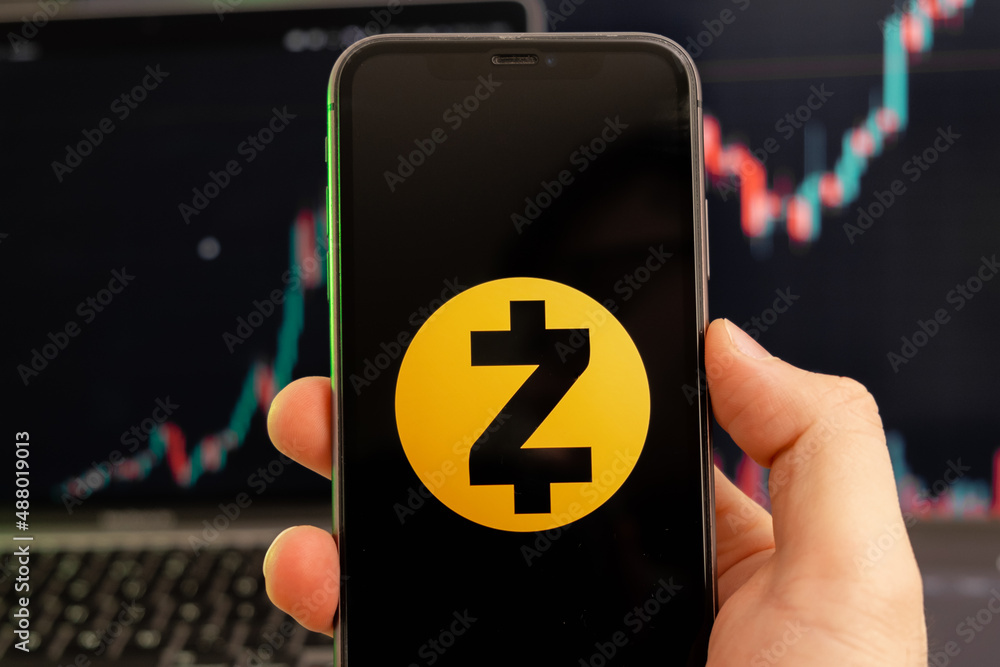 Zcash ZEC cryptocurrency logo on the screen of a smartphone in mans ...