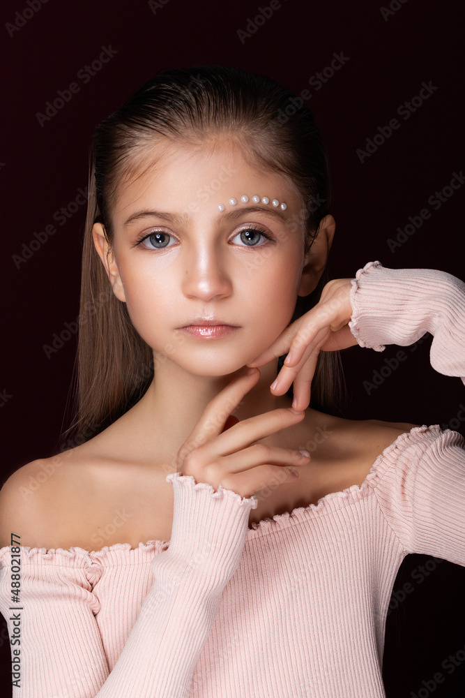 Beautiful little girl posing in studio. Cute little girl. Closeup ...