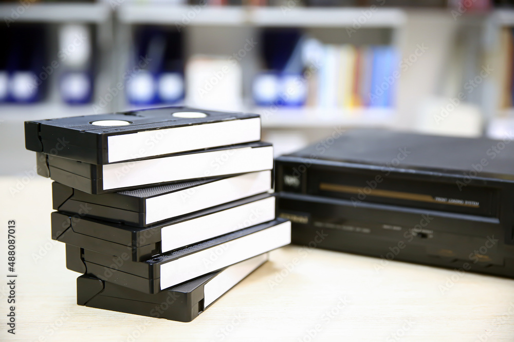 Pile of video cassette tape VHS with video playback old retro style ...